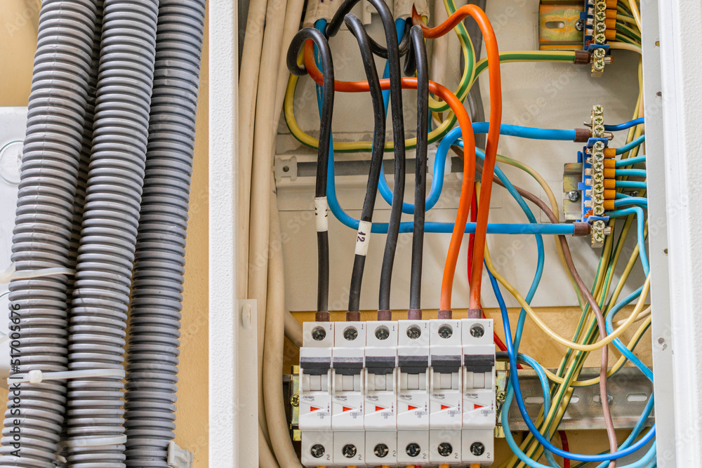 Multi-colored powerful wires are connected to automatic current ...