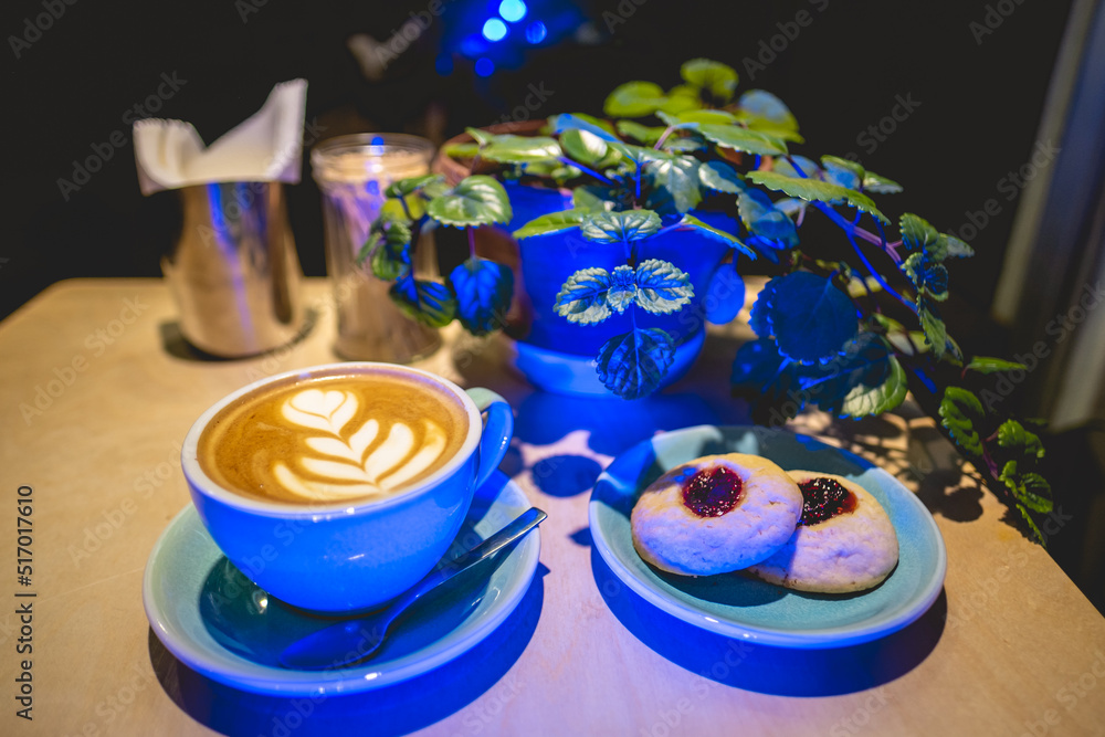 Colorful cup with latte coffee with flower design, delicious homemade ...