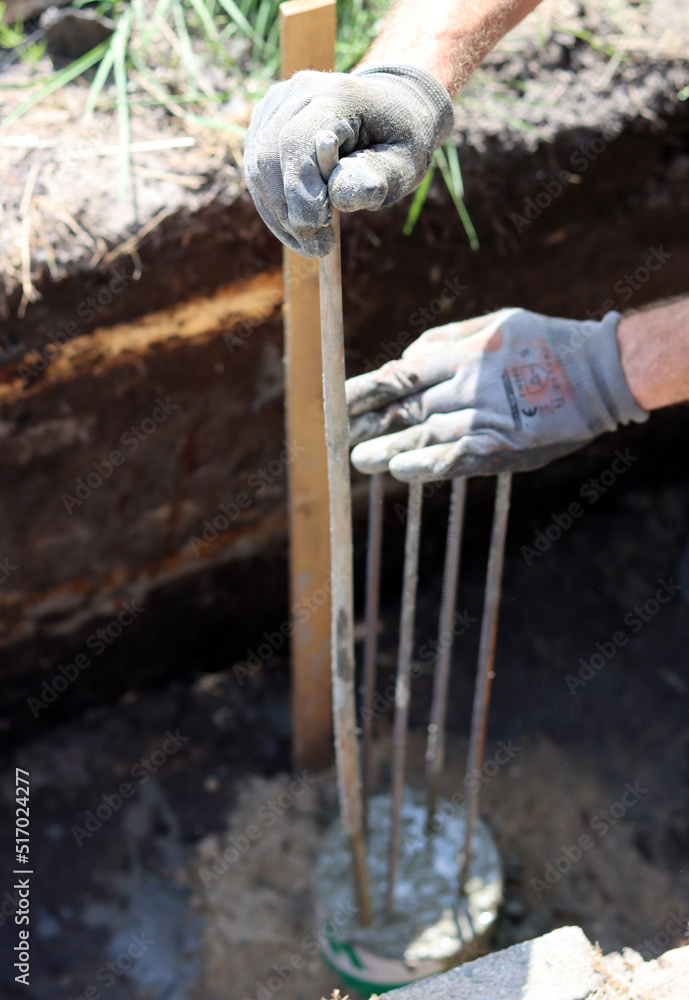 Cement work in progress. Foundation strength work. Bucket of concrete ...