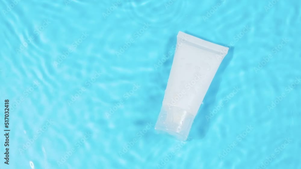 advertising slow motion, cosmetic products in water splash on the ...