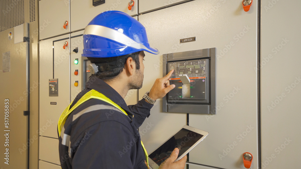 An engineer man or worker, people working in electrical room. Power ...