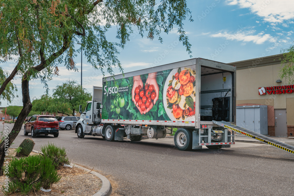A Sysco truck driver unloads his truck at a restaurant Stock Photo ...