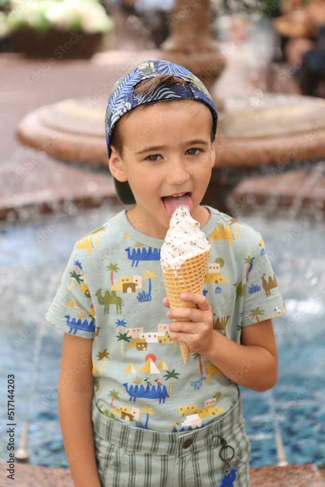Cute russian boy, fun child with ice cream in Moscow city, Russia. Kid ...