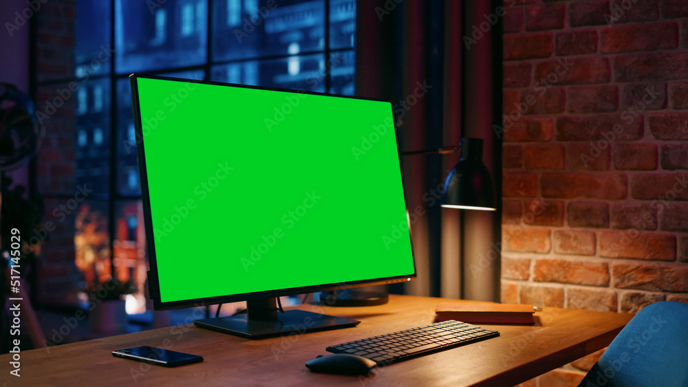 Desktop Computer Monitor Standing on a Table with a Green Screen ...