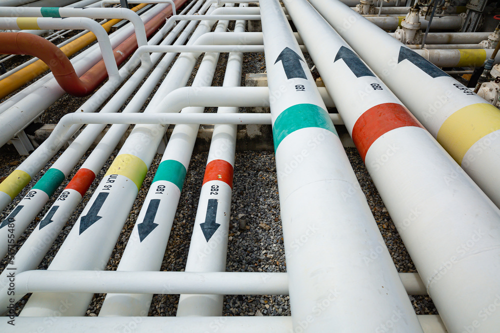 Steel long pipes flowing symbol and pipe elbow in station oil factory ...