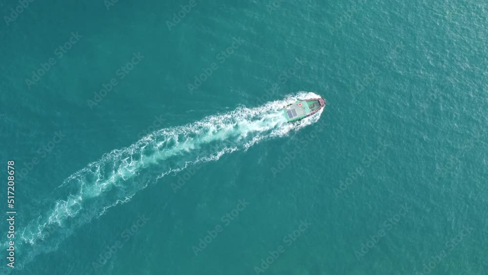 Bird's eye view of a moving boat with a trace Stock ビデオ | Adobe Stock