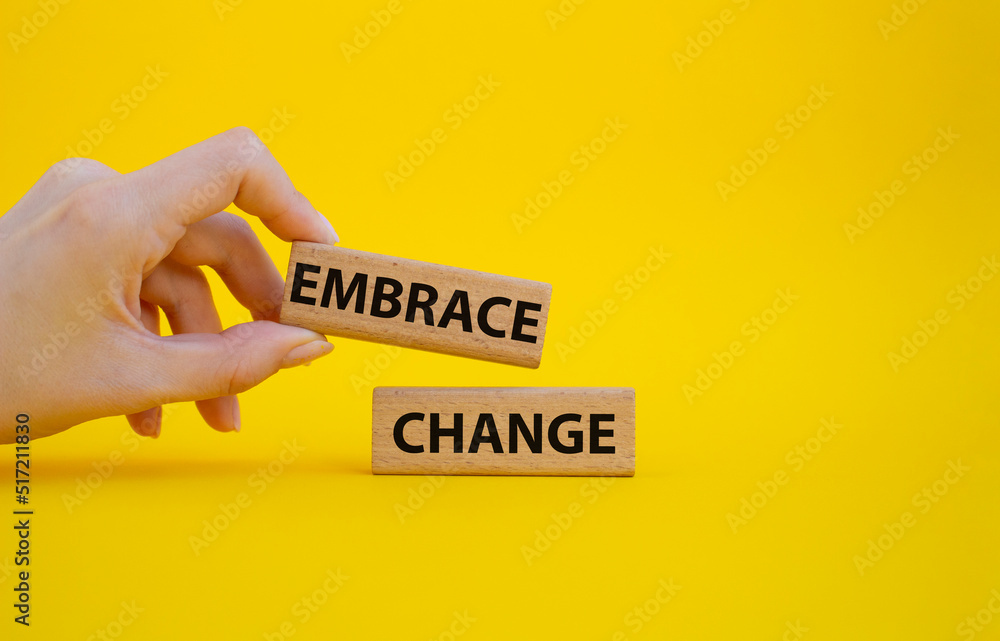 Embrace change symbol. Concept word Embrace change on wooden blocks ...