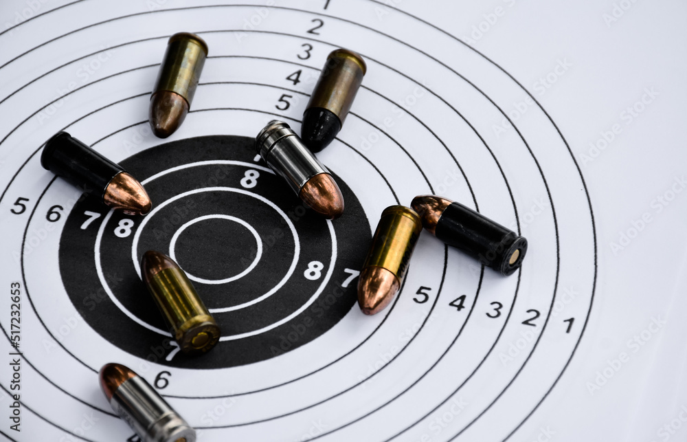 9mm pistol bullets on white target shooting paper, soft and selective ...