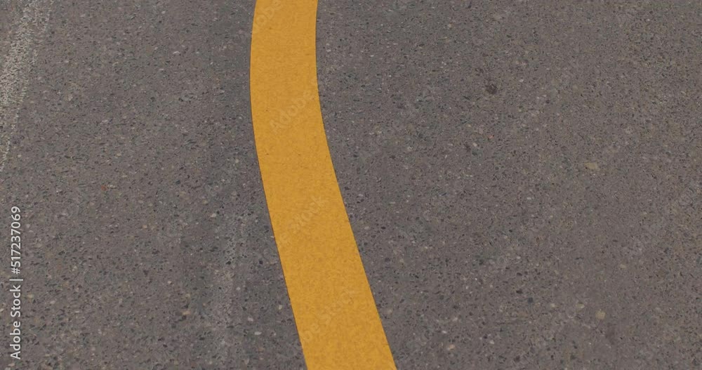 Rough line in an urban environment. Close up. Curved road markings ...