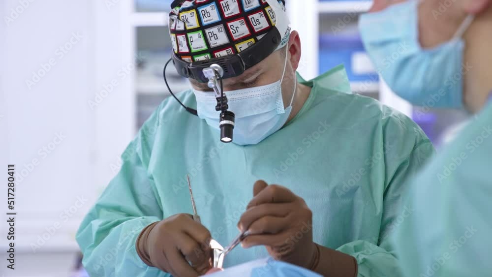 Stockvideo Focused surgeon applies tools to a patient’s nose. Doctor ...