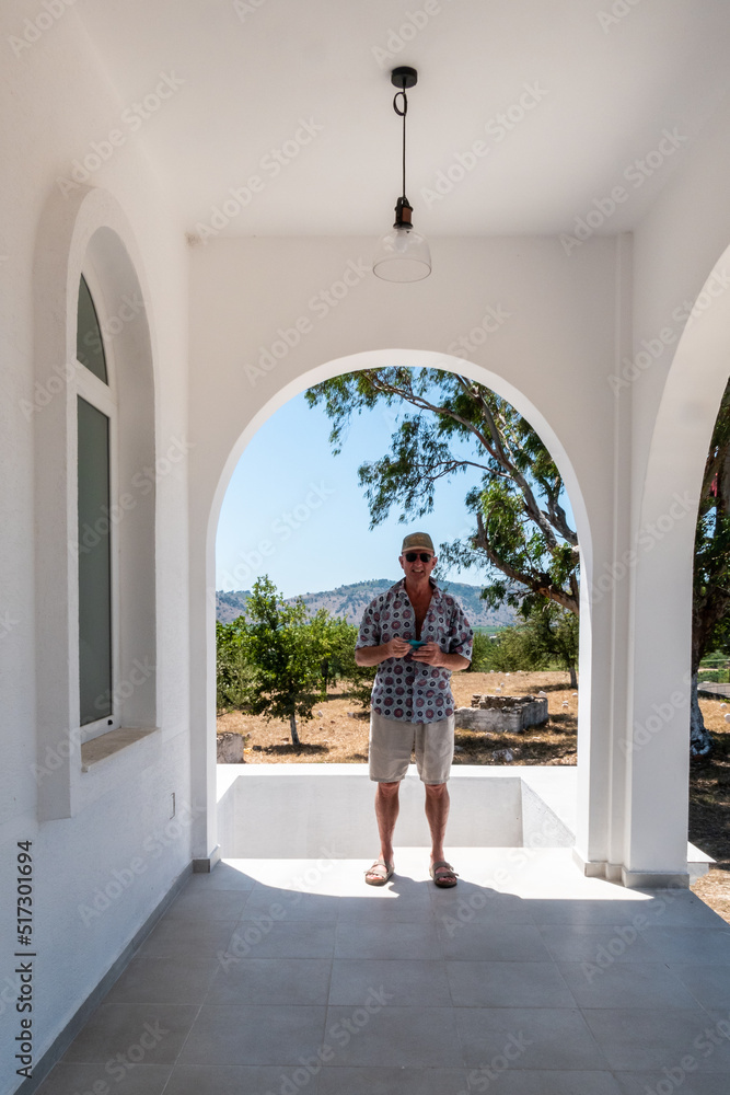 Xarre, Albania A tourist stands at the I Love Cameria memorial and ...