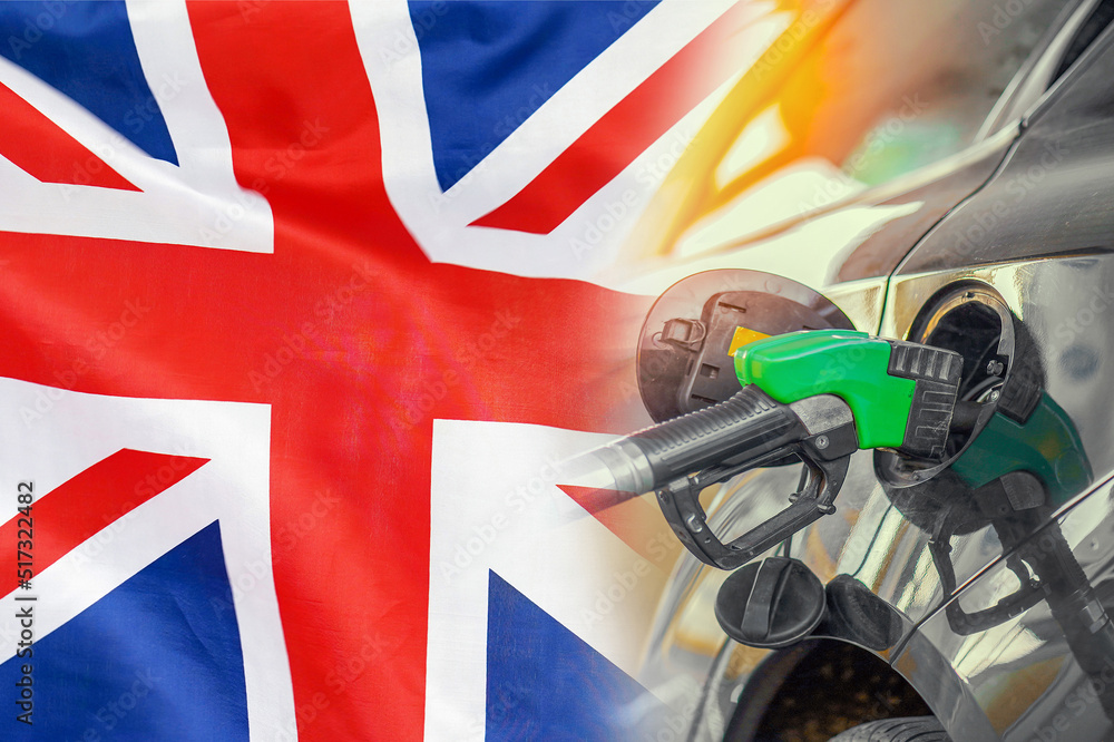 Car with a fuel injector on UK flag background. Record prices fuel for ...