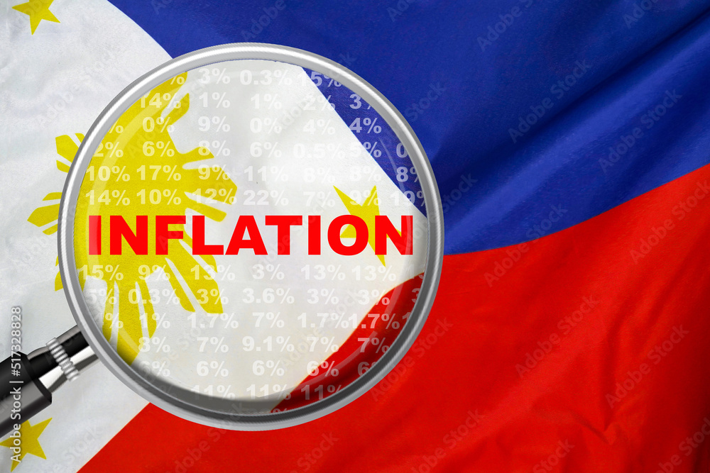 Magnifying glass focused on the word inflation on Philippines flag ...