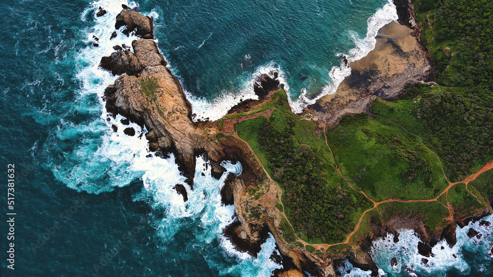 Foto de aerial top down of punta cometa pacific ocean cliff waves view ...