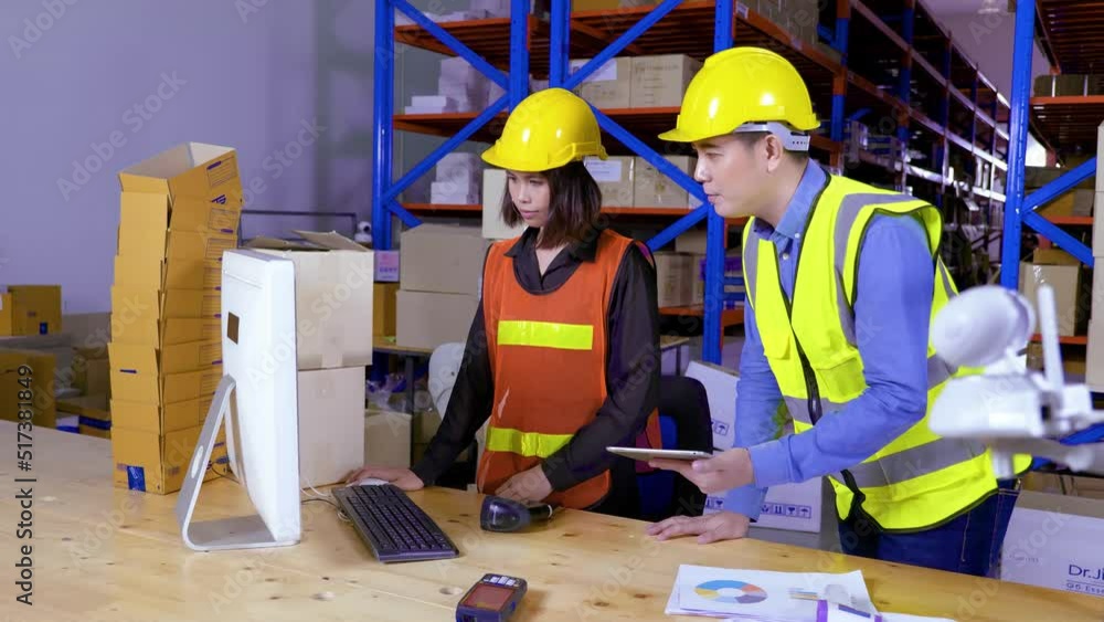 Professional workers in uniform with helmet are checking the products ...