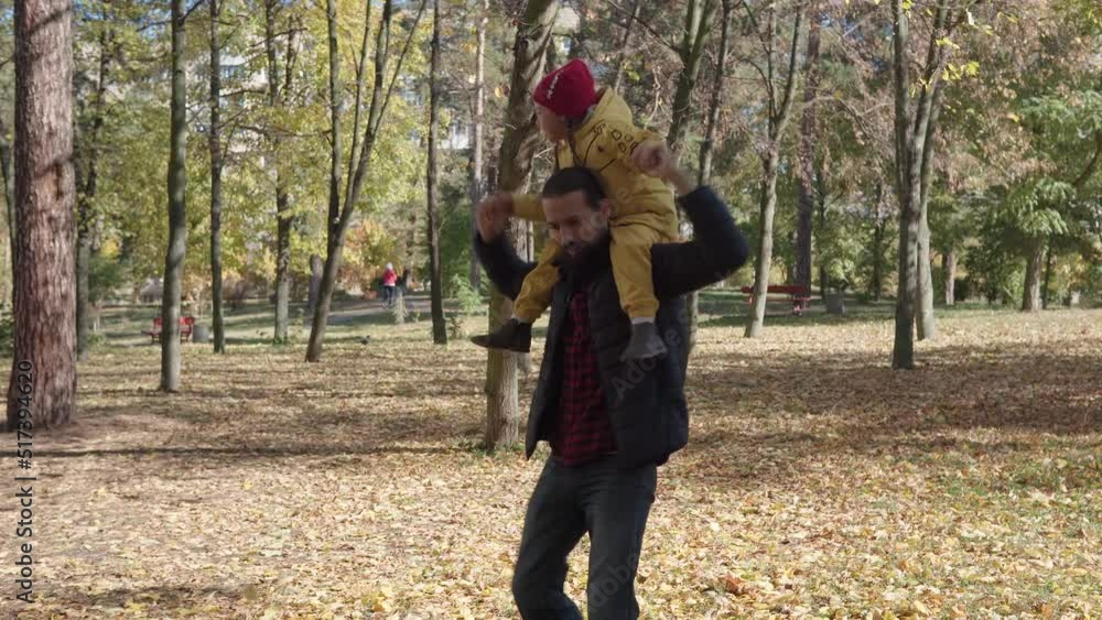 Fatherhood. happy funny family daddy children in park with dad enjoying ...