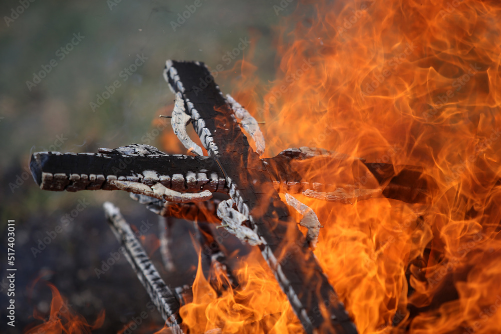 Ancient traditions of burning bonfires in cemeteries, when old crosses ...