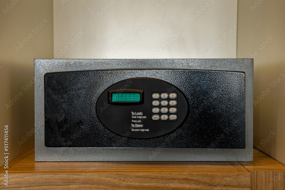 front loading in-room hotel safe with electronic lock located inside a ...