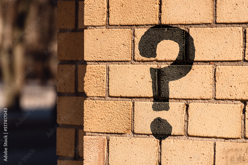 Question mark concept or FAQ. The sign is painted on a brick wall Stock ...