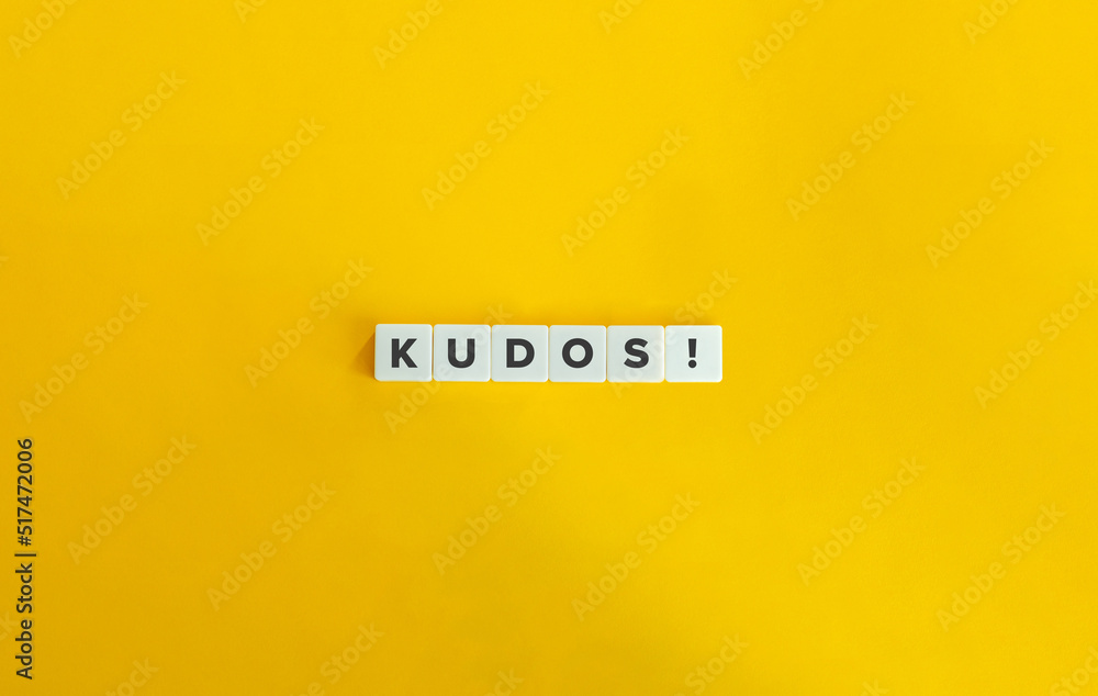 Kudos Word on Block Letter Tiles on Yellow Background. Minimal ...