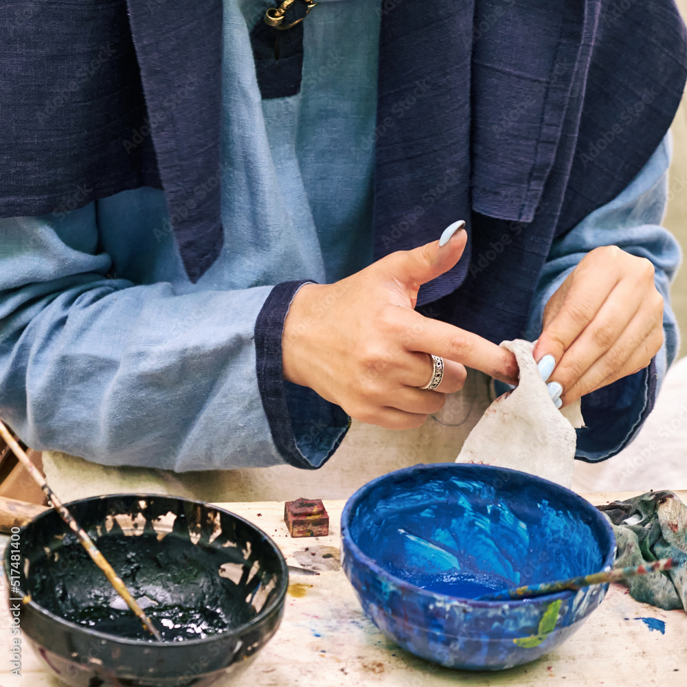 Making paints from herbs and minerals for coloring medieval retro ...