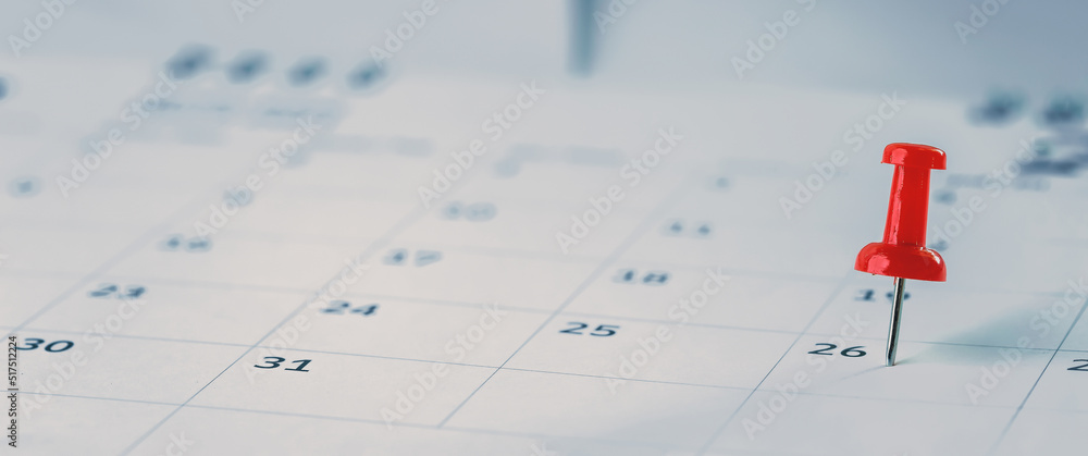 Foto de Embroidered red pins on a calendar event Planner calendar,clock ...