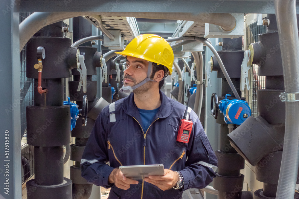 Engineer under checking the industry chilled water fan coil unit air ...