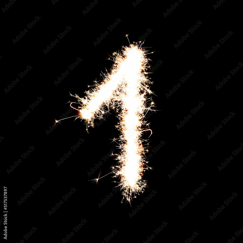 Sparkling sparkler in the shape of numbers on a black background ...