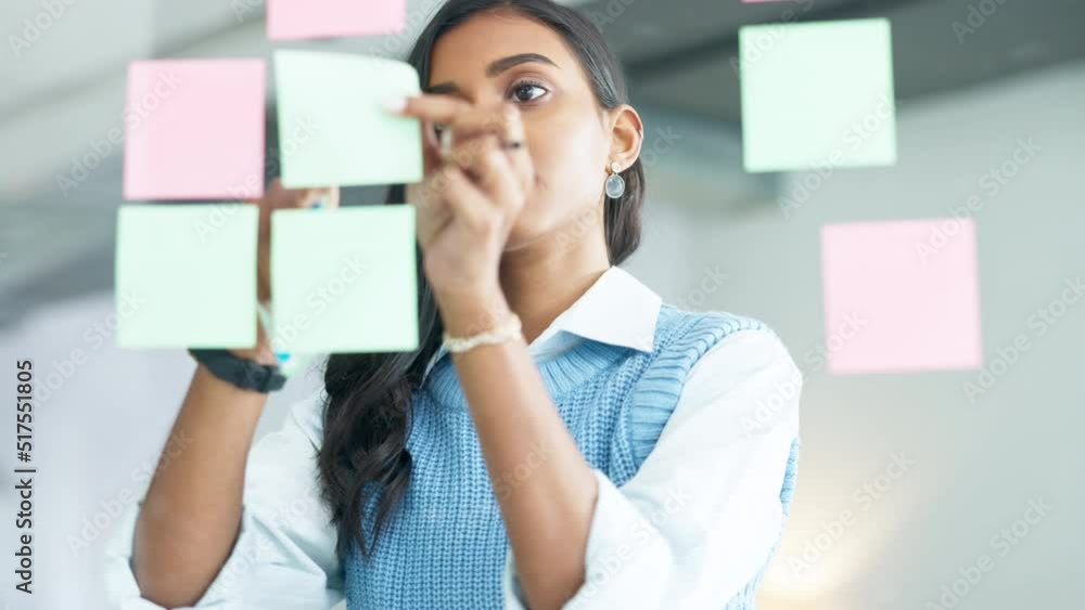 Young business woman brainstorming and planning a mind map while ...