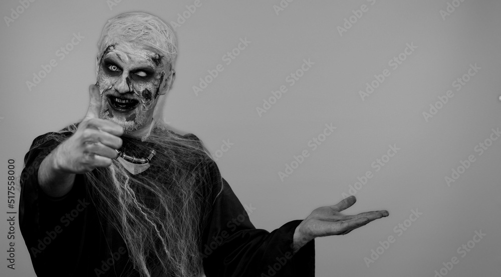 Creepy man with bloody scars face, Halloween stylish zombie make-up ...