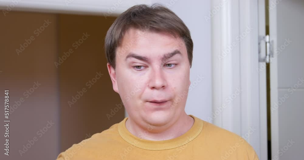 Close-up of the face of a man who makes grimaces. Surprise, raised ...