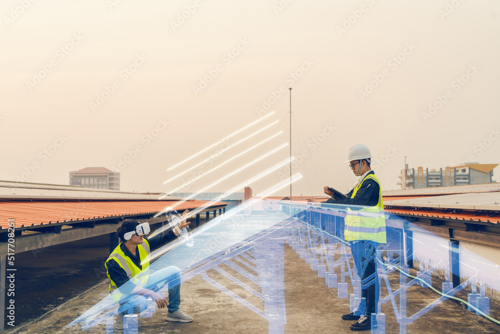 Two Electrical engineer team design solar energy system with hologram ...