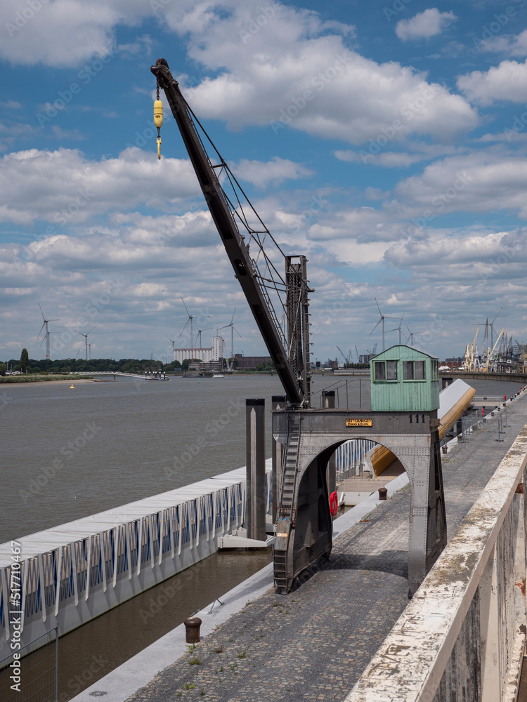 Old crane with the maximum load capacity of 2000 kilograms on the quay ...