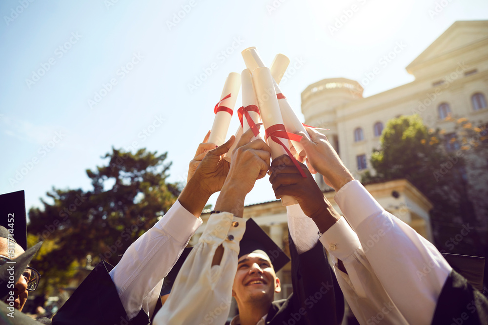 Happy university students celebrating their graduation. Diverse group ...