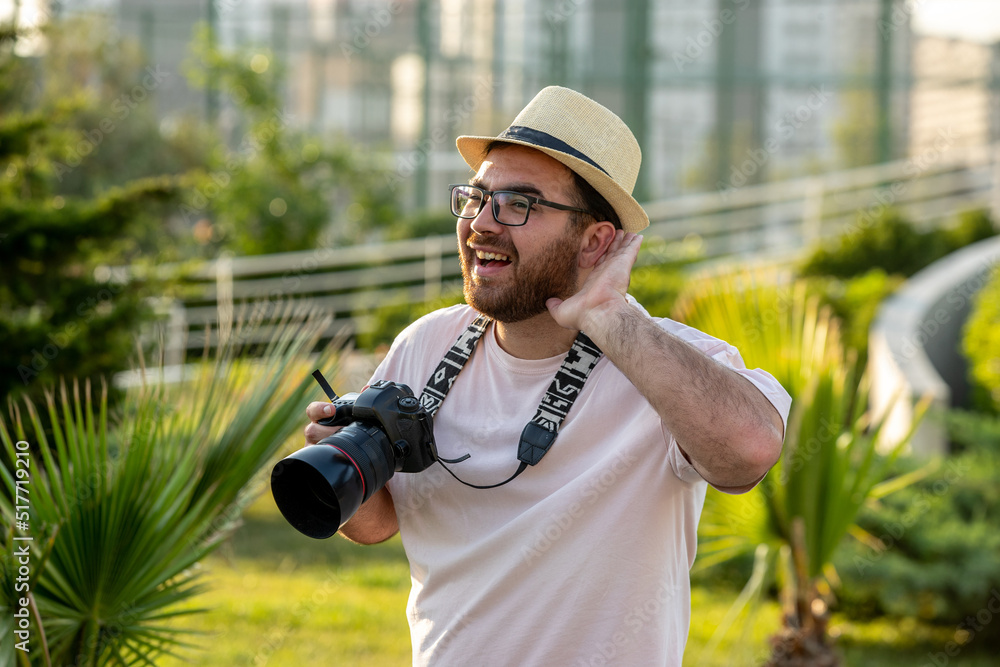 photographer professional guy with camera on the photoshoot at park in ...