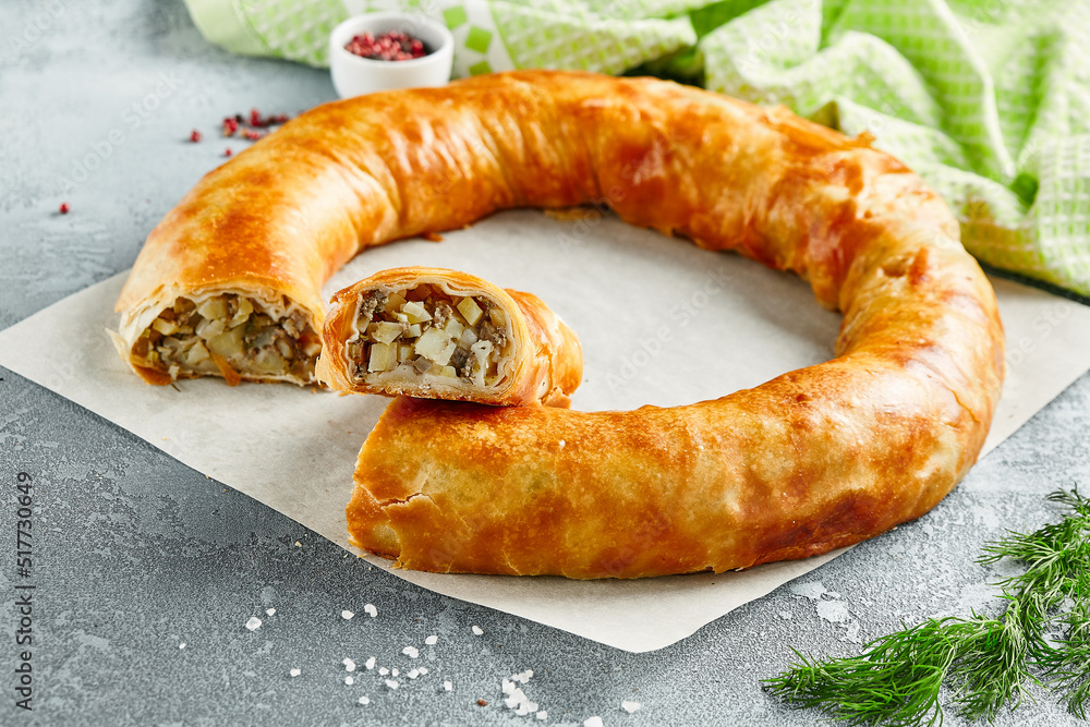 Classic turkish pie with meat and potato on wooden board. Composition ...