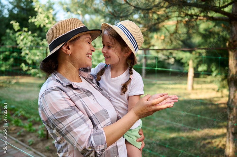 Mom and daughter in family eco farm. Instilling love for Earth and ...