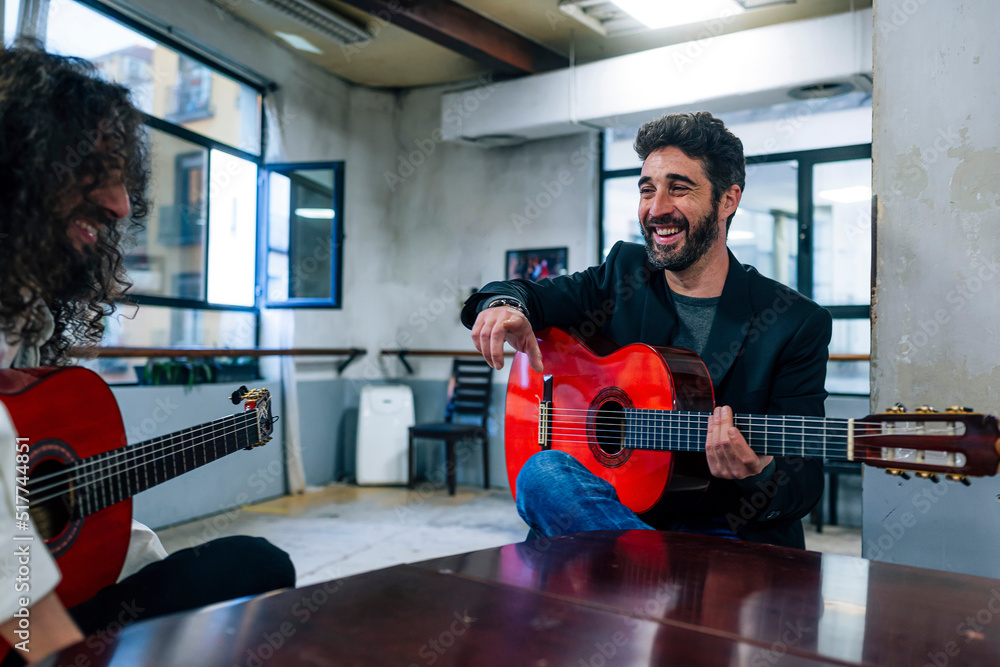 Men Playing Guitars In Music Studio Stock Photo | Adobe Stock