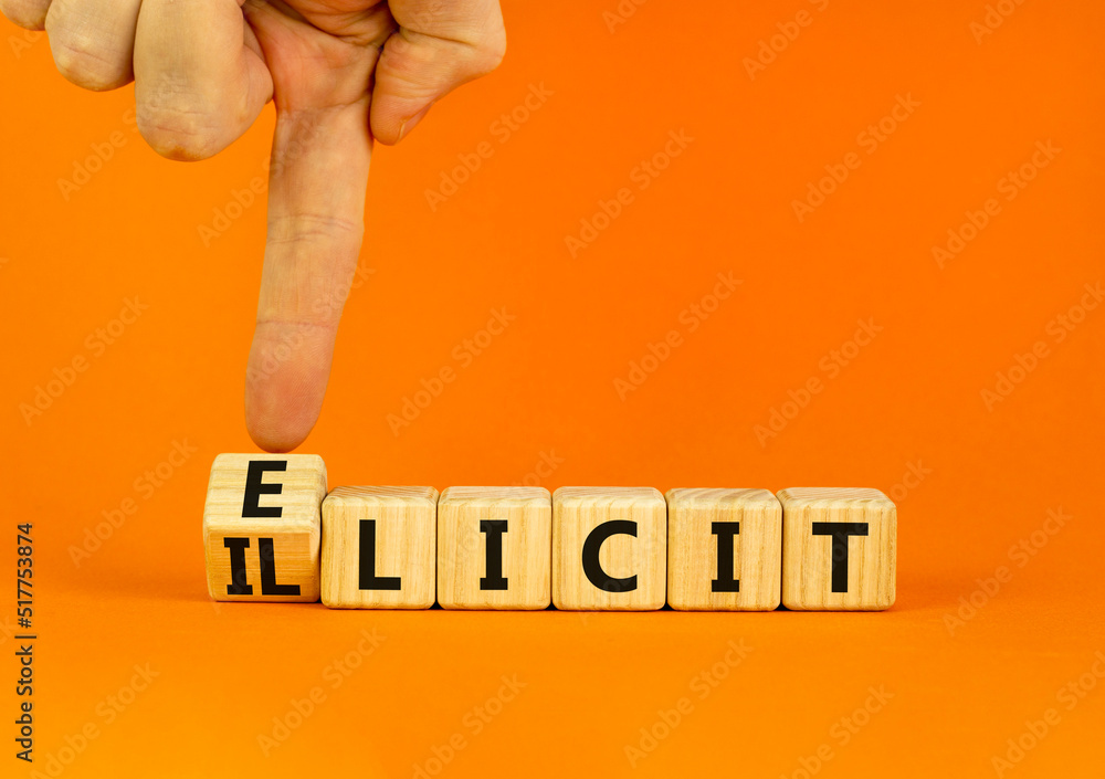 Illicit or elicit symbol. Businessman turns wooden cubes and changes ...