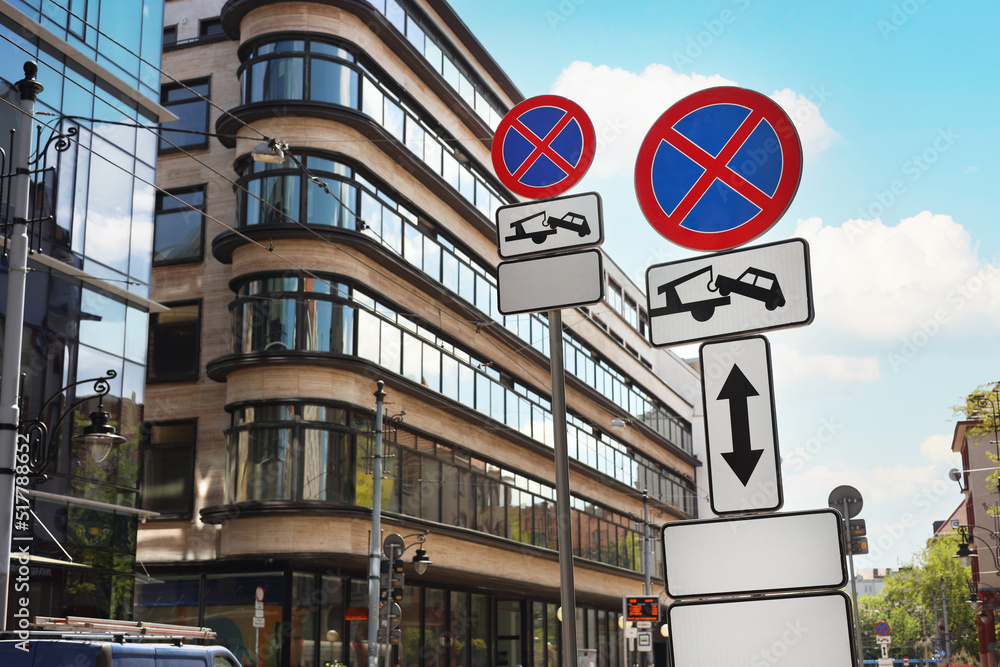 Posts with No stopping road signs and complementary plates on city ...