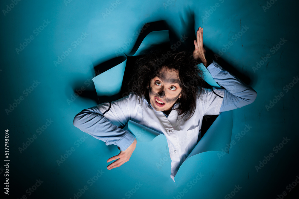 Lunatic silly chemist with messy hairstyle, looking funny while making ...