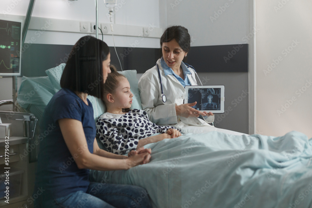 Fotka „Radiology expert examining radiography scan image of sick little ...
