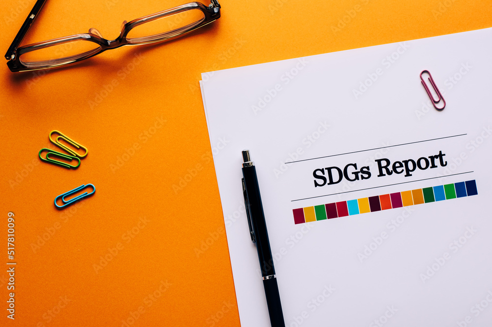 There is a dummy document of SDGs Report on the desk. Stock Photo ...