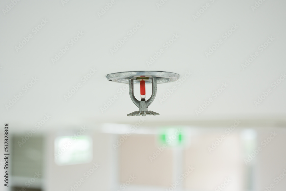 Fire fighting equipment, sprinkler on white ceiling background ...
