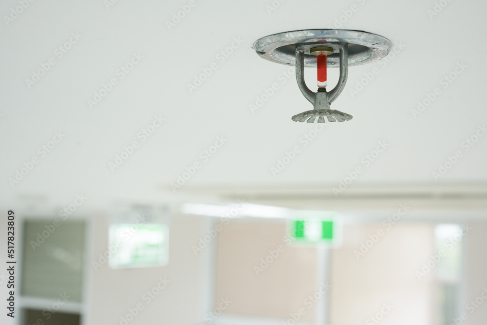 Fire fighting equipment, sprinkler on white ceiling background ...