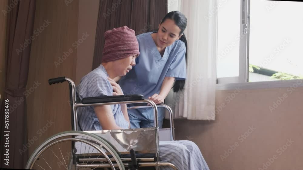 Uniformed young Asian female therapy doctor with wheelchair male ...