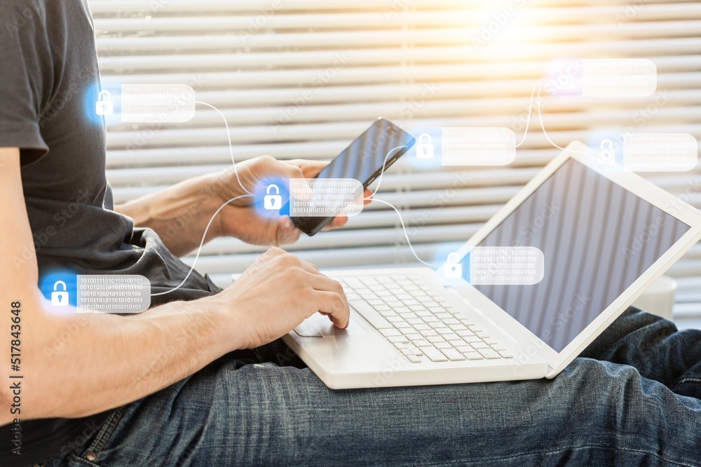 Foto de Two steps authentication concept. Virtual safety icon while access on phone with laptop ...