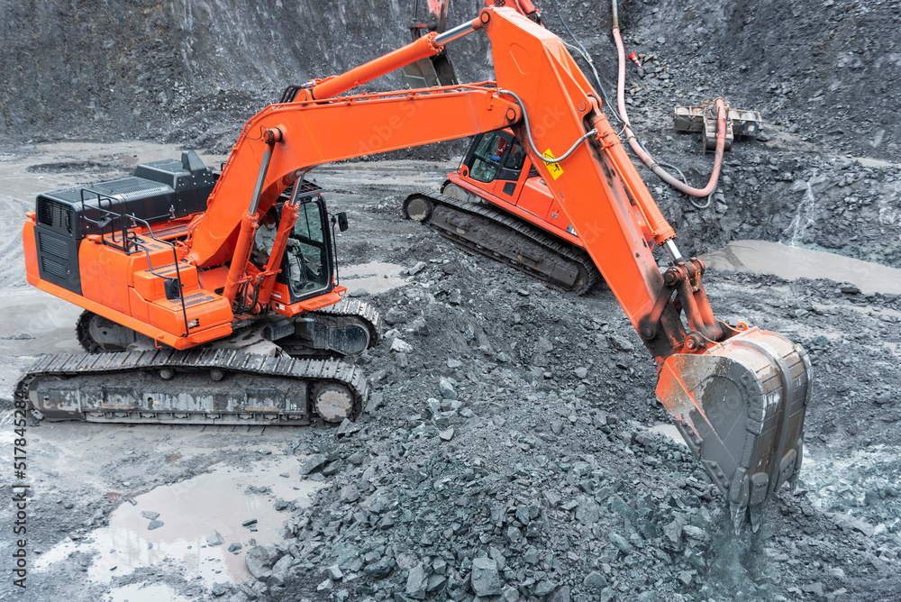 Open pit quarry, heavy equipment digs gravel: construction industry ...