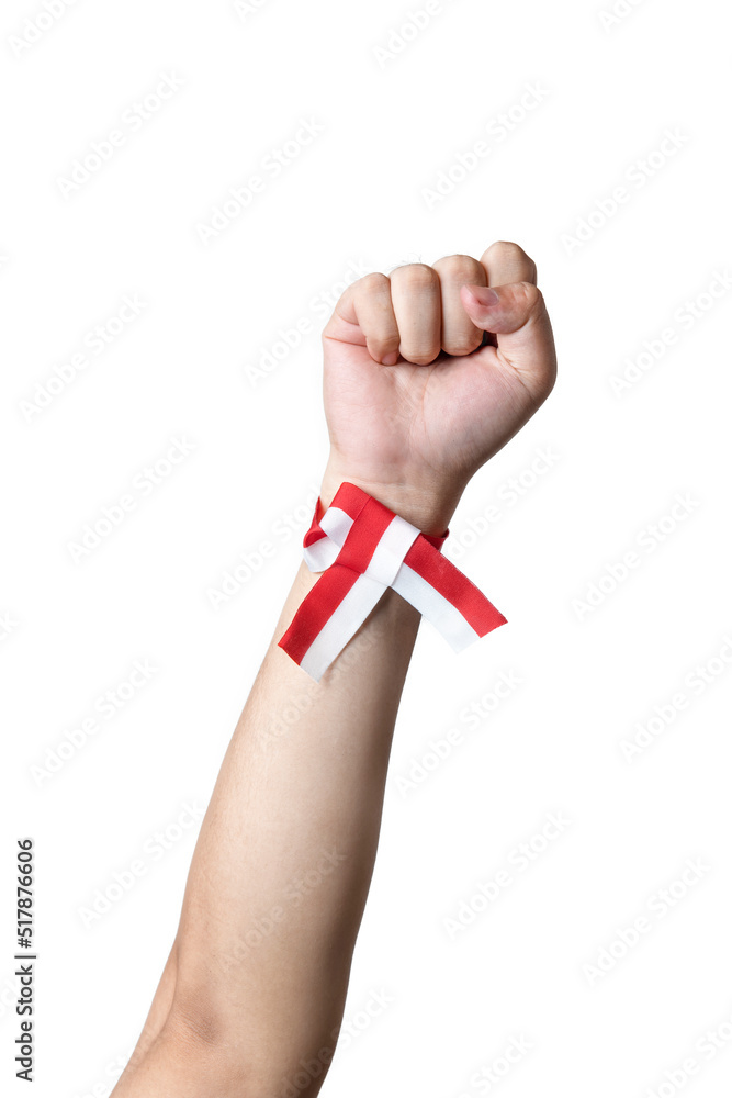 Human hand showing ribbon with the red and white color of the ...