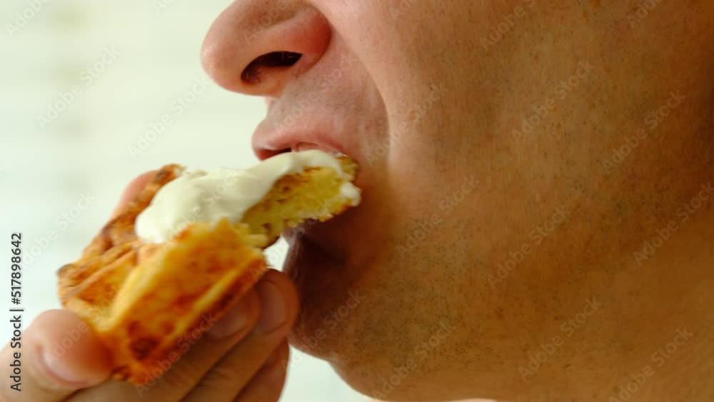 close up a mouth of a man eating a sweet waffle Stock Video | Adobe Stock
